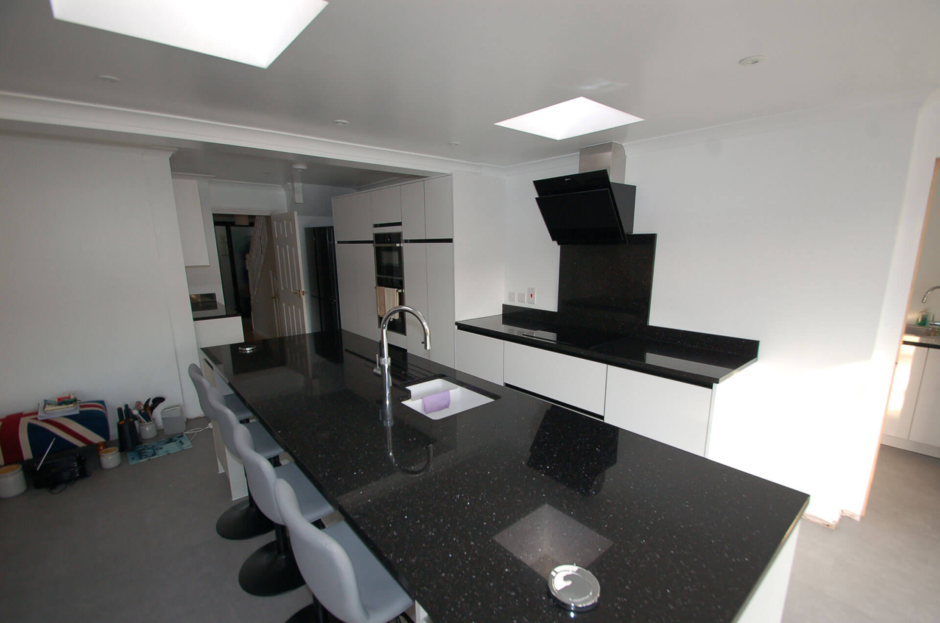 White-handless-kitchen-with-large-island - MBK Design Studio